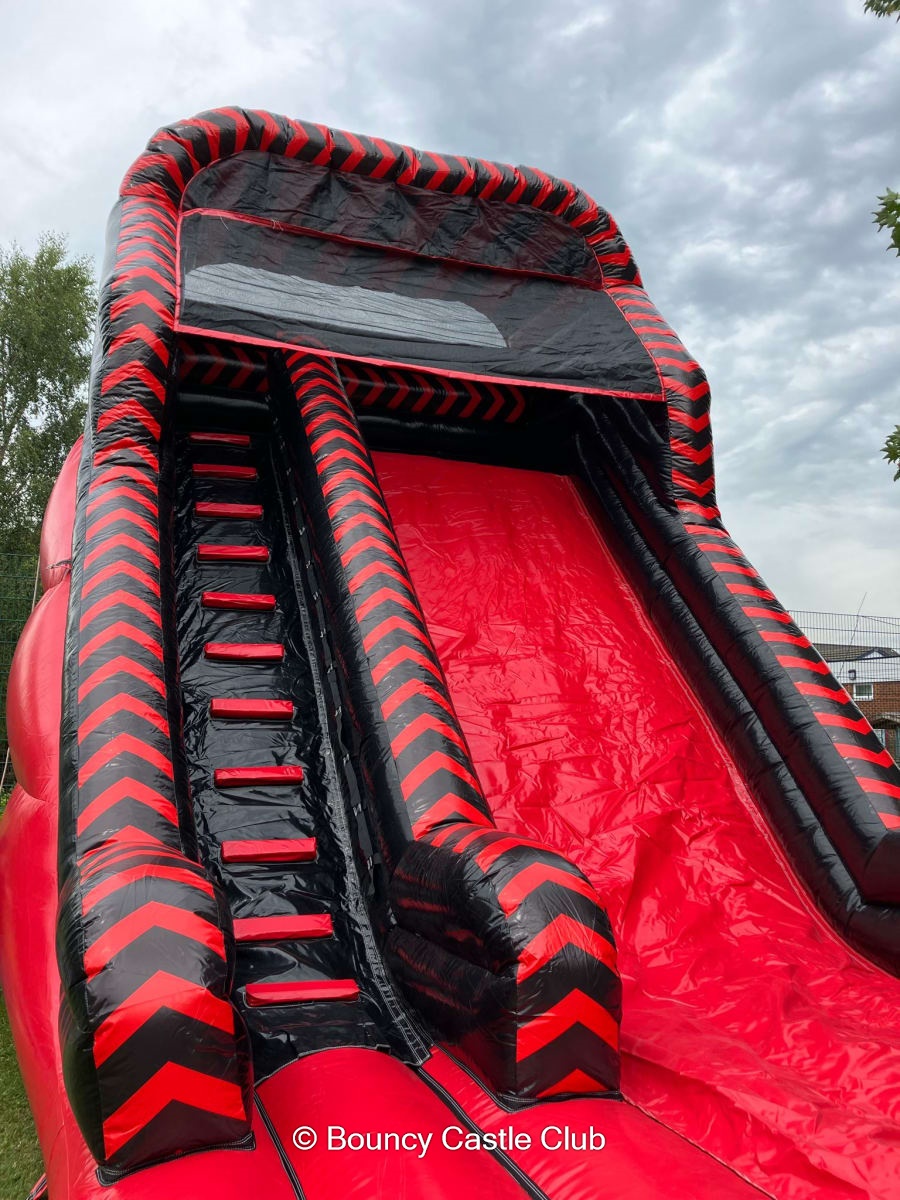 Red Black Mega Slide Hire | Giant Inflatable Slide